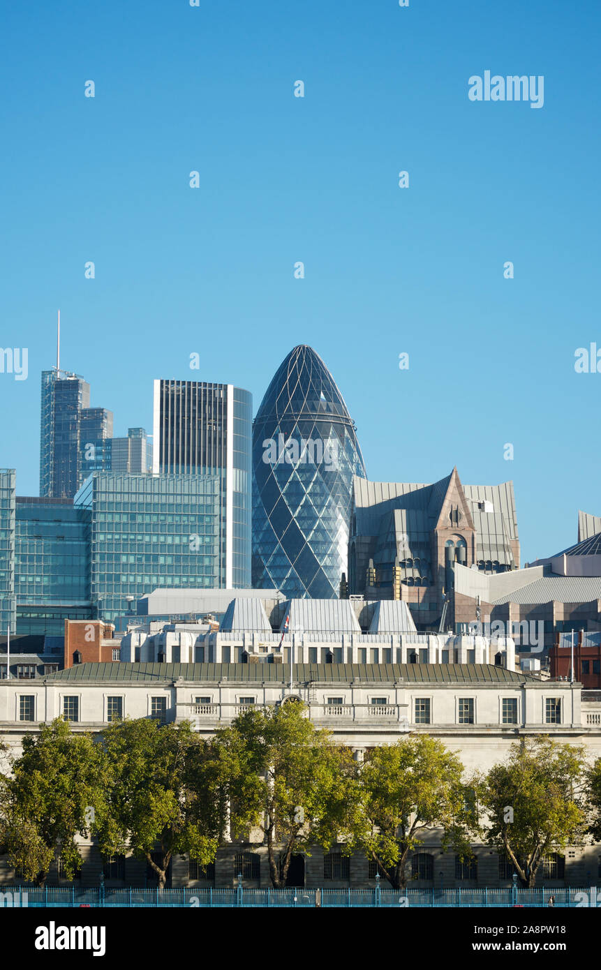 Blue sky view of the London city skyline on a bright summer afternoon ...