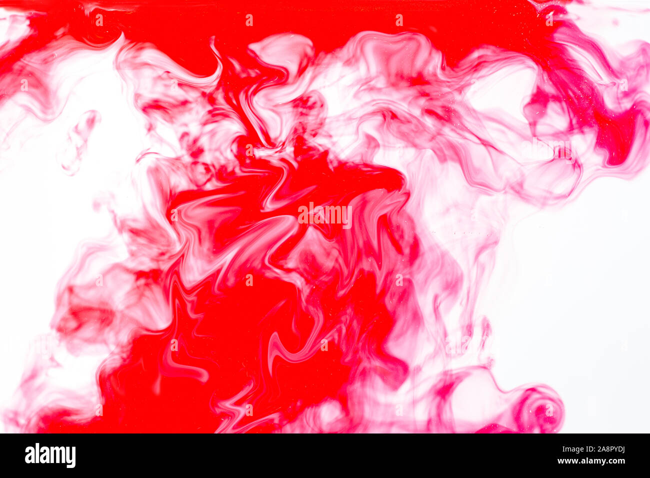 Red ink background that dissolves in water Stock Photo - Alamy