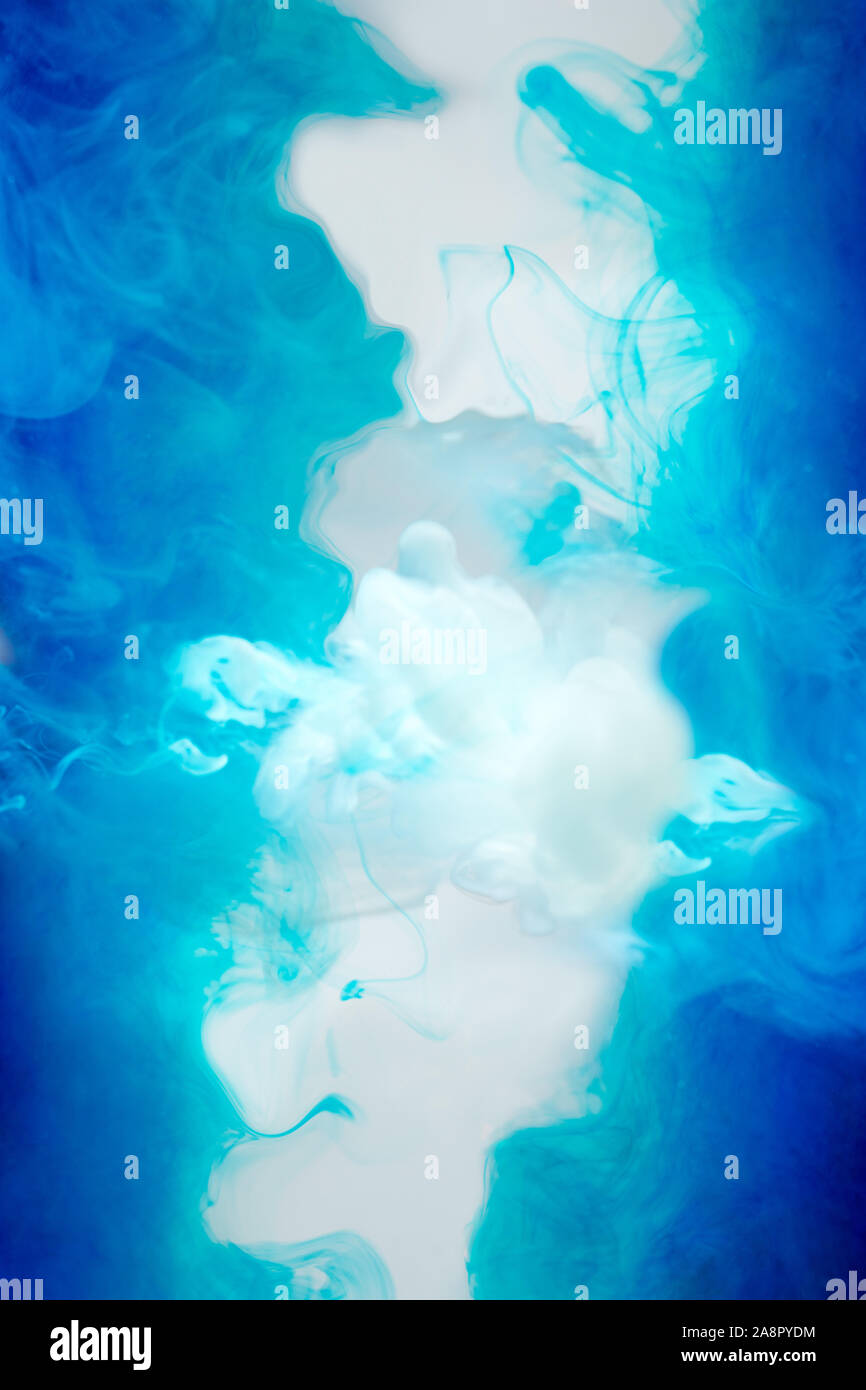 Blue ink waves in white fluid on white background Stock Photo - Alamy