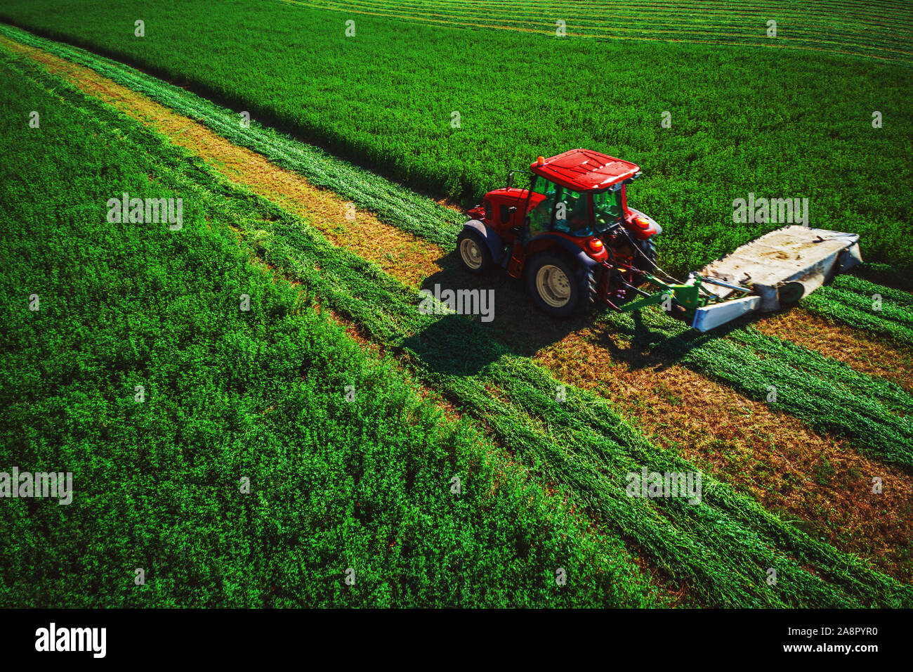 Tractor mowing grass field mow hi-res stock photography and images - Alamy