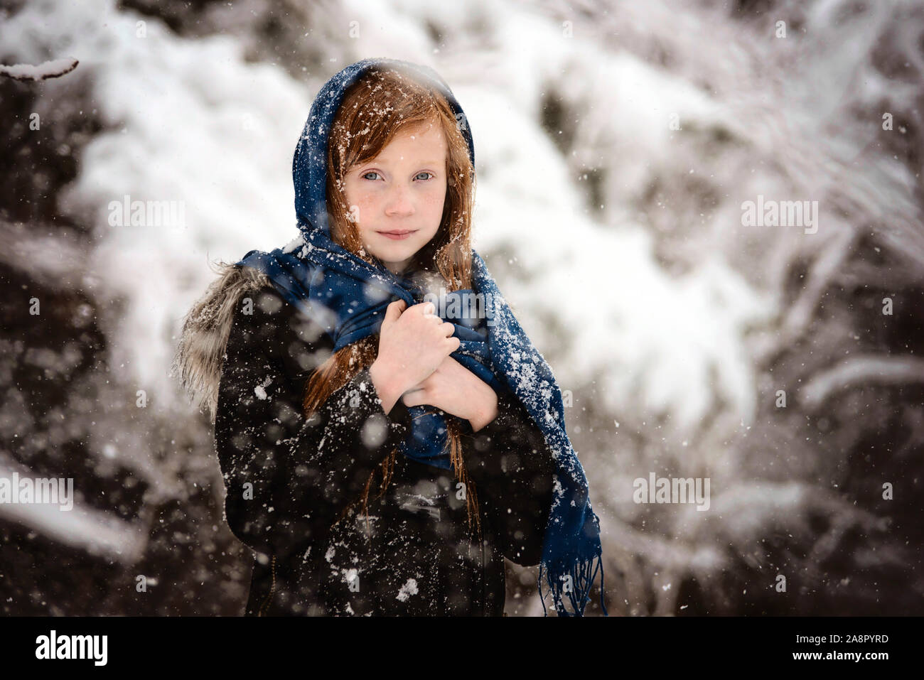 Young Red Haired Girl Playing outside in the Snow Stock Photo - Alamy