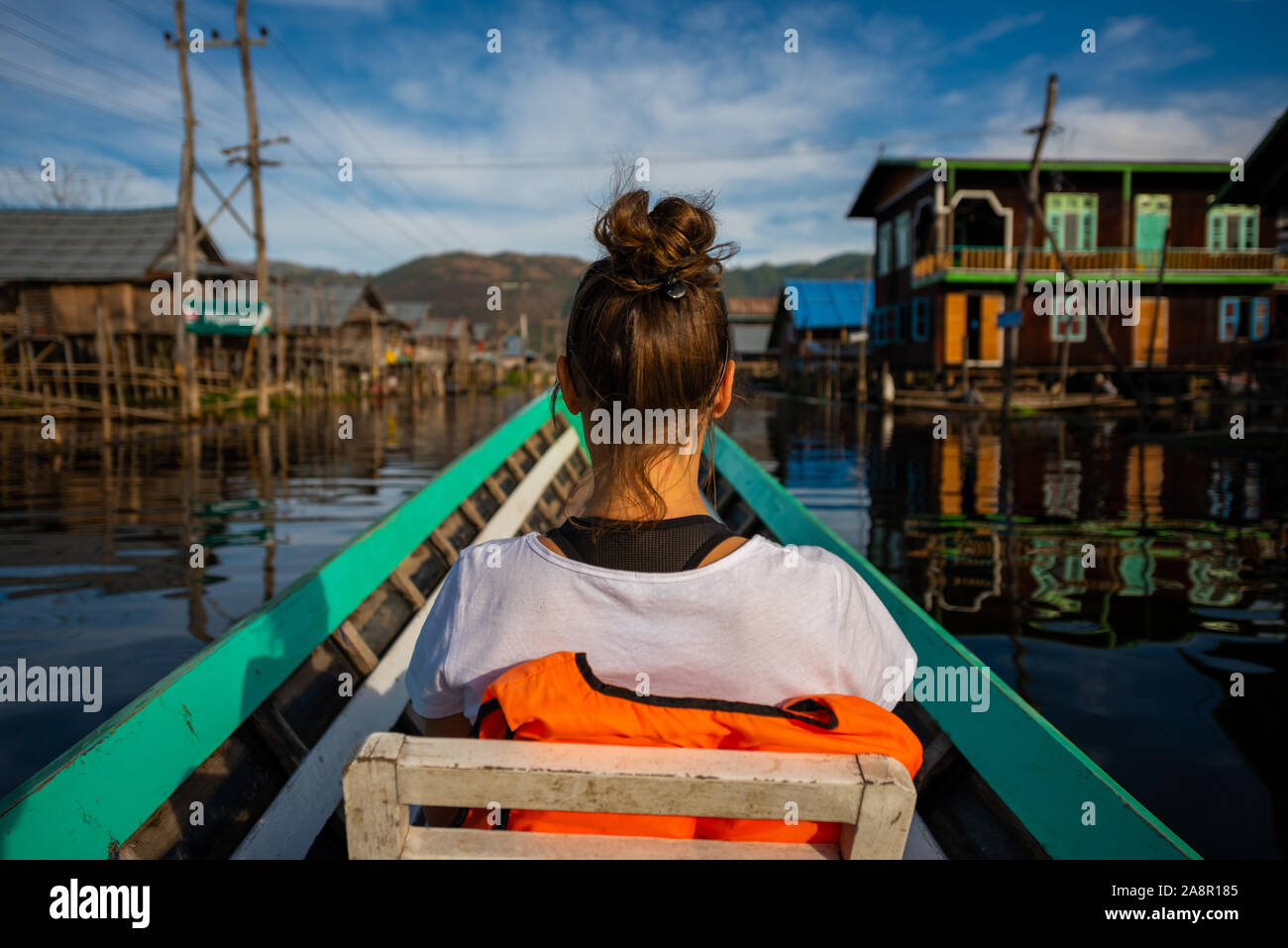 Tourist admire beautiful scenery from the boat on Inle Lake. Shan state ...