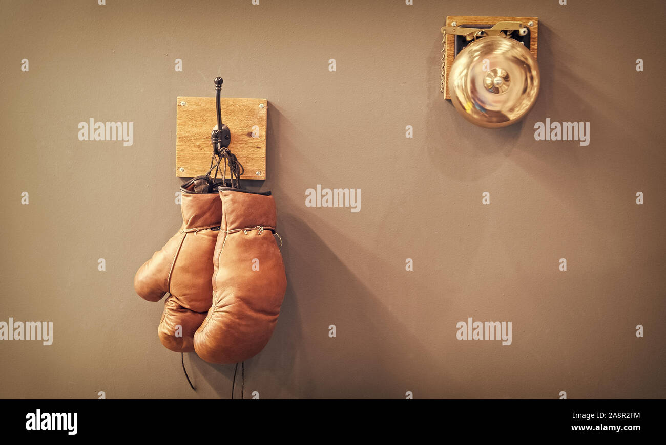 history of sport. vintage gong and worn gloves. stamina. final gong in ...