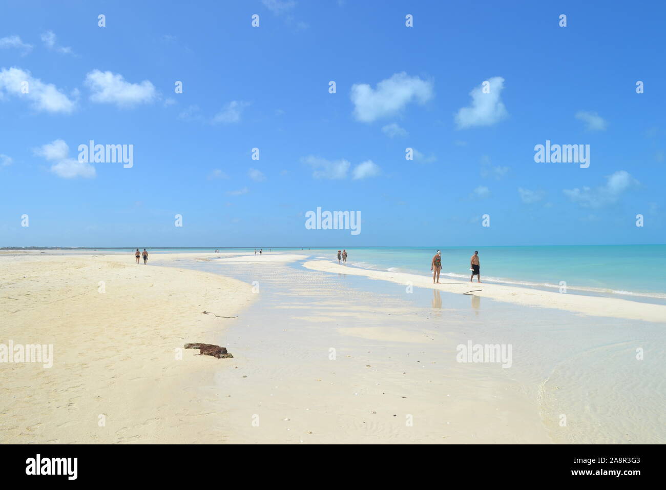 Beahj at Cayo Coco, Cuba with silhouettes of people Stock Photo - Alamy