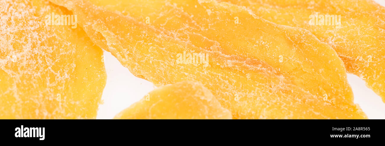 close up view of dried mango slices isolated on white, panoramic shot ...