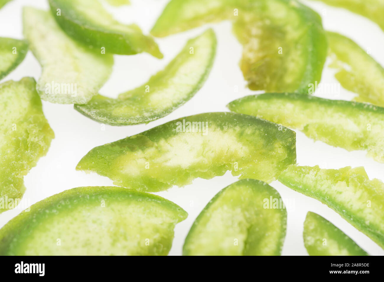 close up view of green sugary candied fruit isolated on white Stock ...
