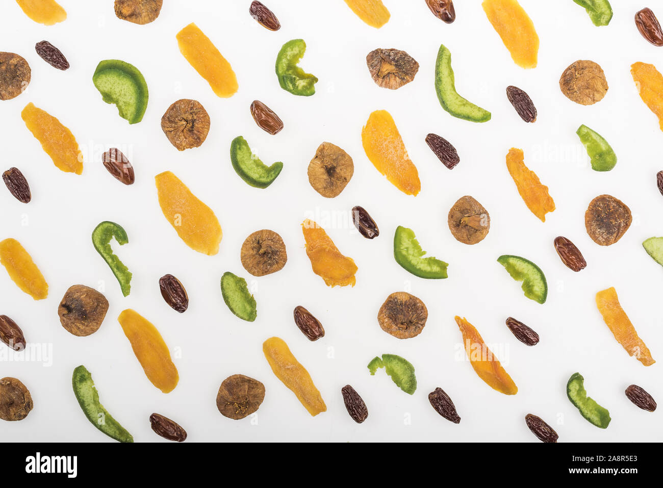 top view of assorted dried fruits and candied fruit isolated on white ...