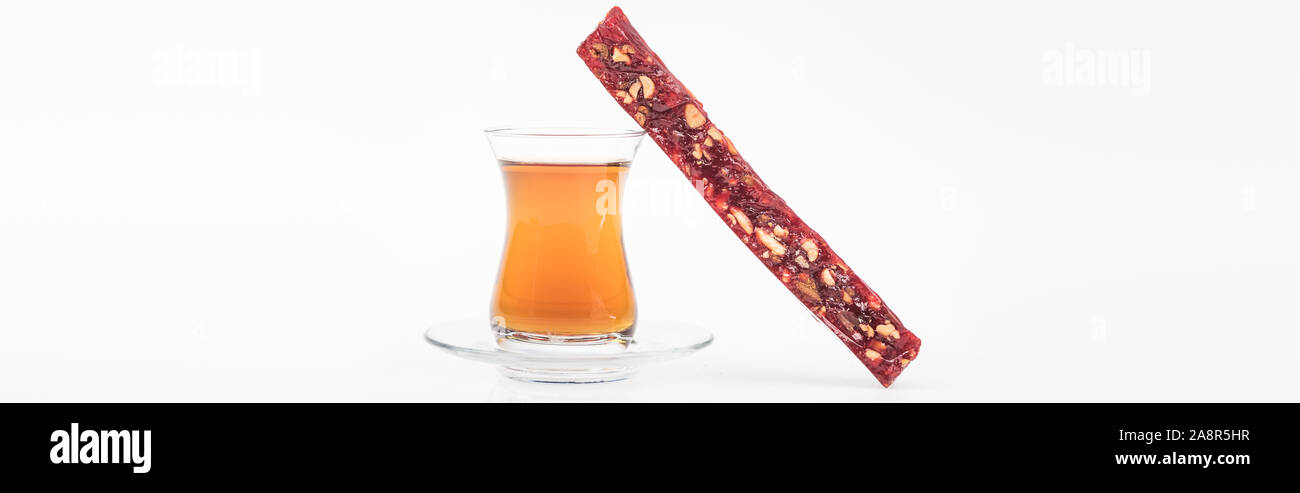 sweet turkish delight with nuts and tea isolated on white, panoramic ...