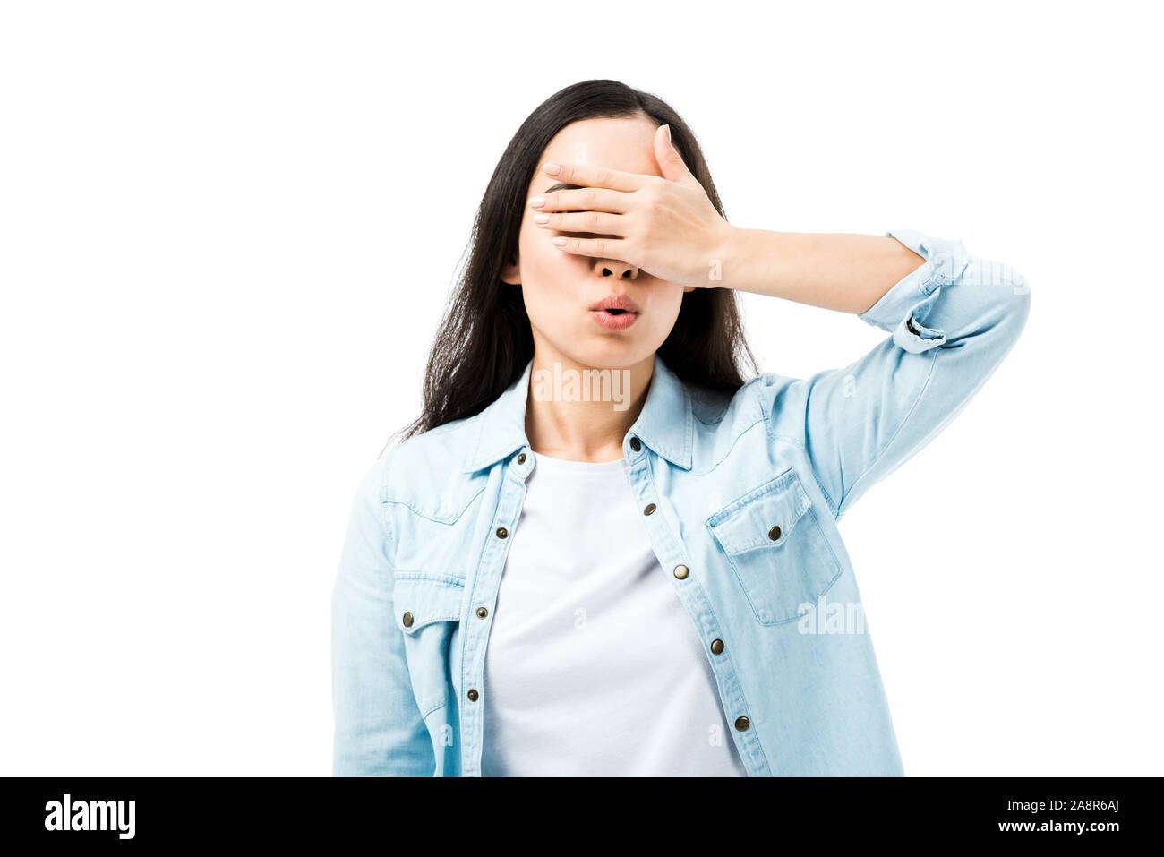 shocked woman in denim shirt obscuring face isolated on white Stock ...
