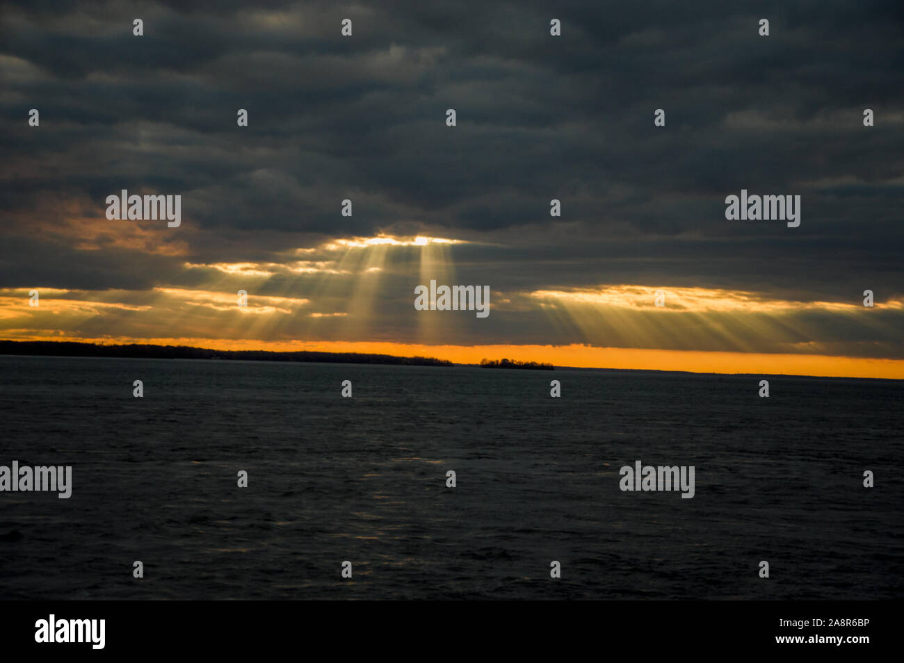 Sun rays passing through the clouds Stock Photo - Alamy