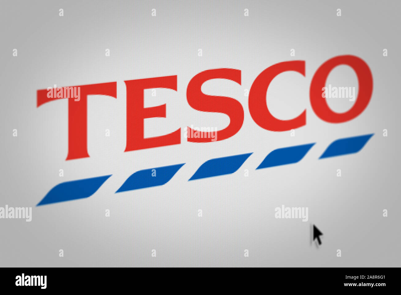 Logo of the public company Tesco displayed on a computer screen in ...