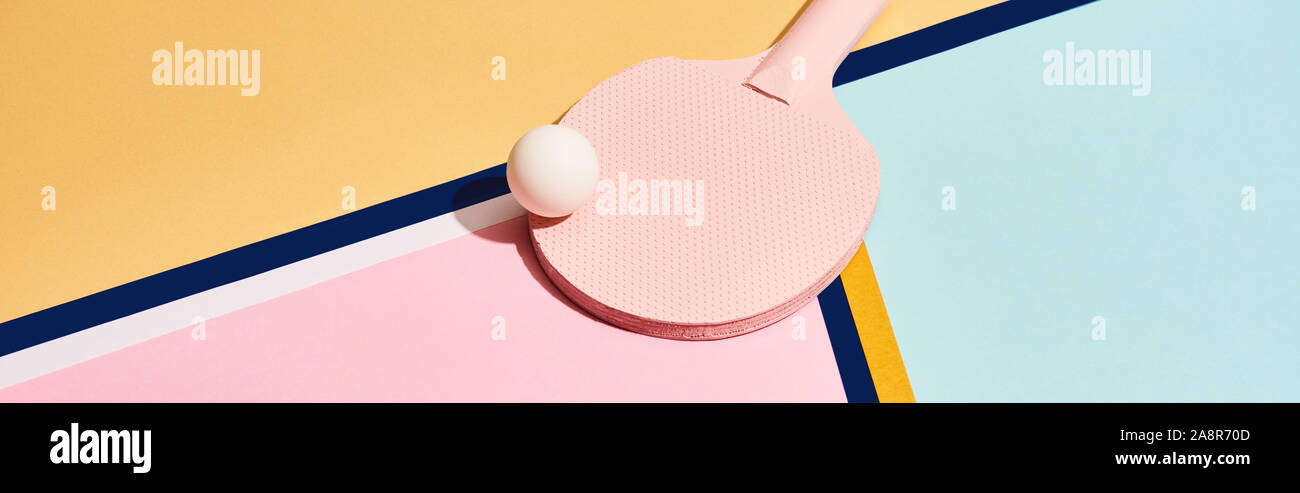 Pink ping pong racket and ball on abstract background with blue lines ...
