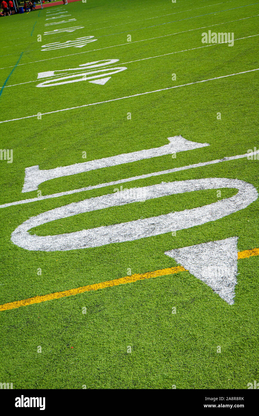 Ten yard line of football field tillted at an angle Stock Photo - Alamy