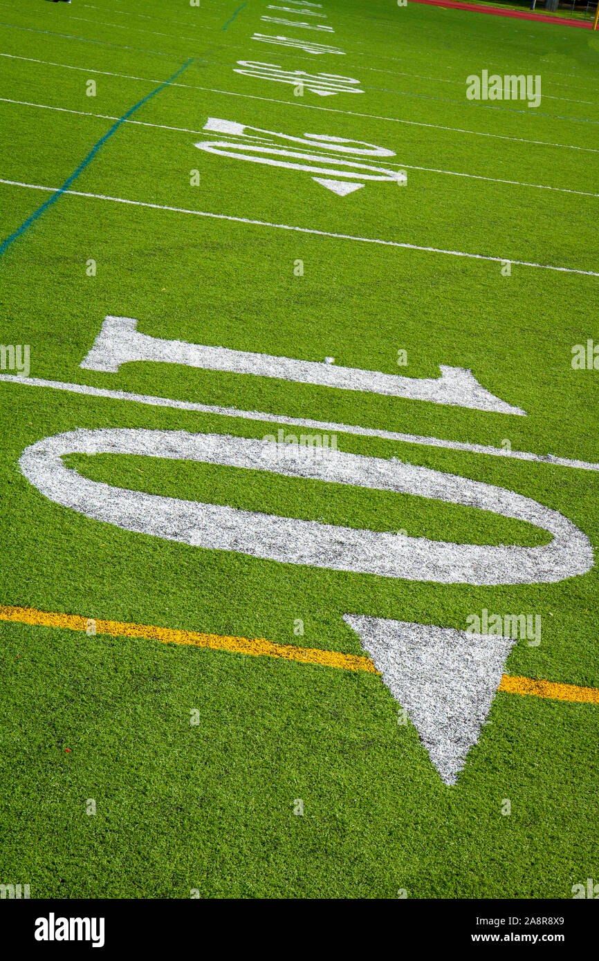 Ten yard line of football field tillted at an angle Stock Photo - Alamy