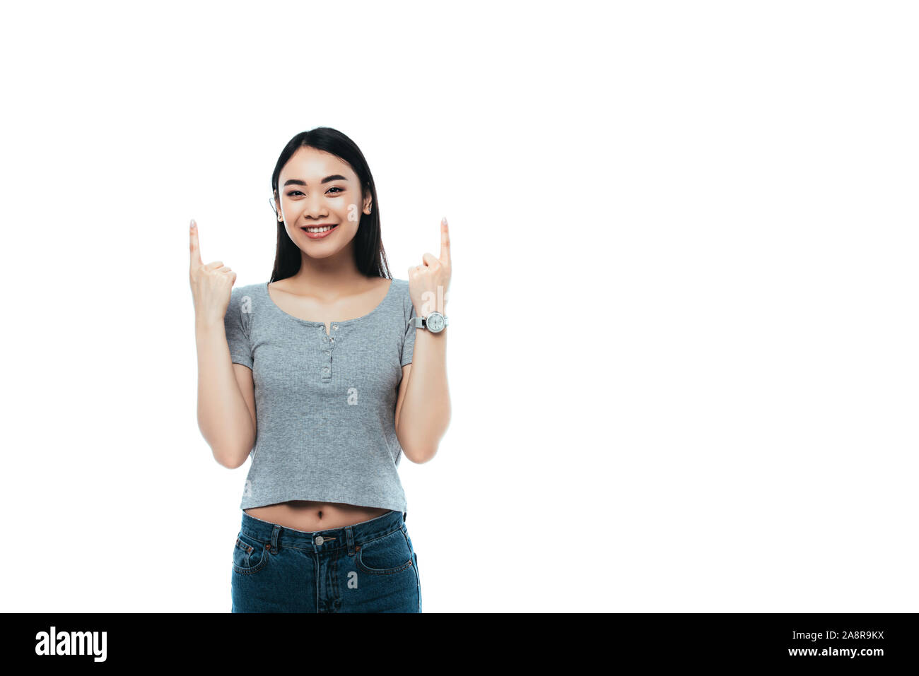 happy asian girl pointing with fingers upwards isolated on white Stock ...