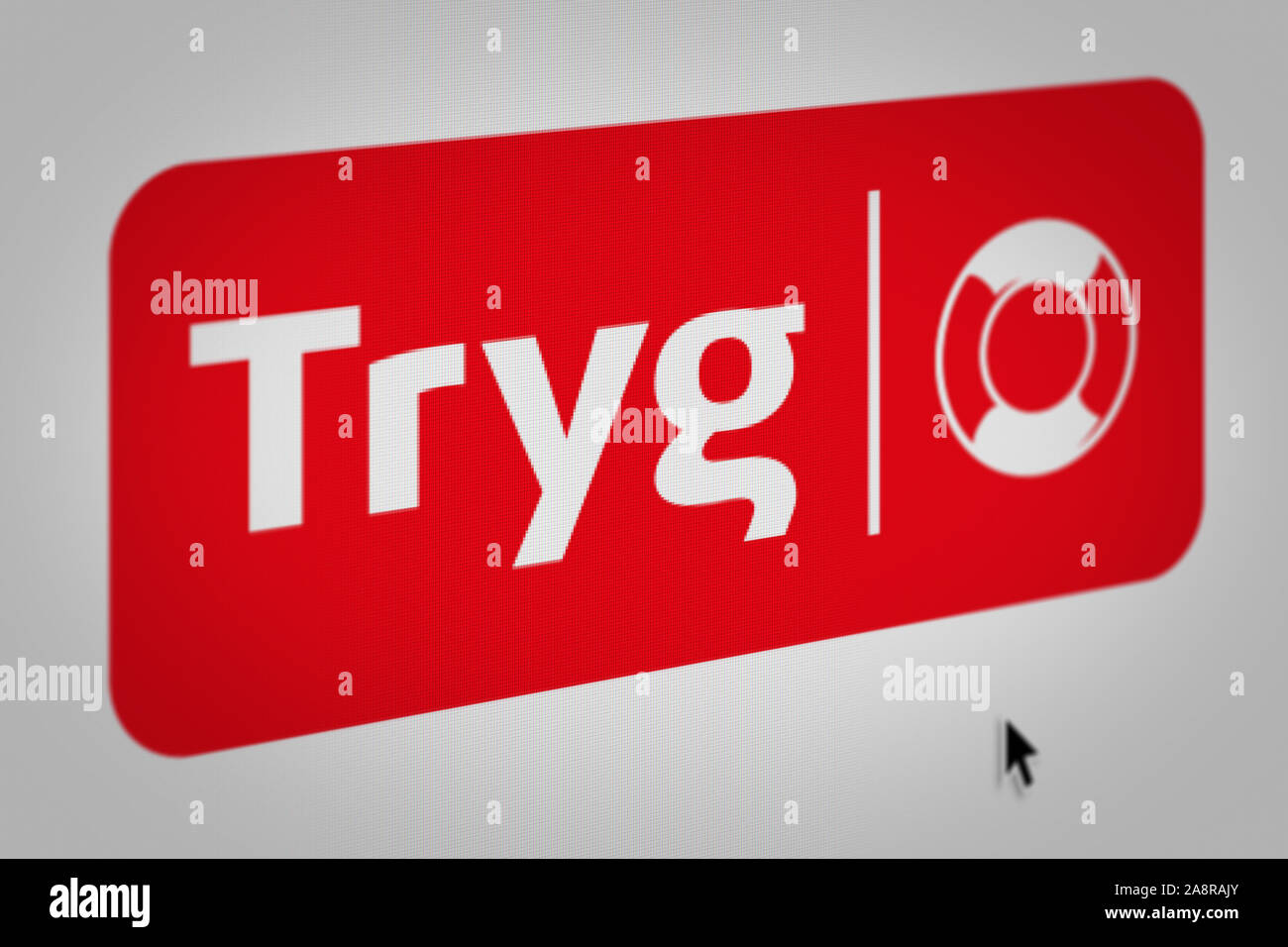 Logo of the public company Tryg displayed on a computer screen in close ...
