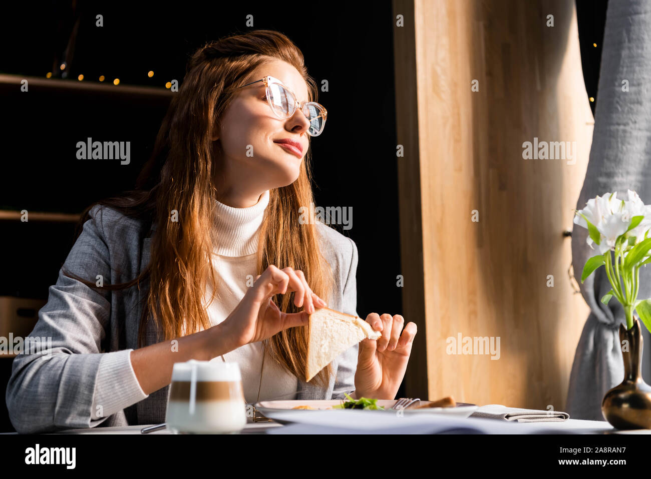 attractive dreamy woman eating breakfast with coffee in cafe Stock ...
