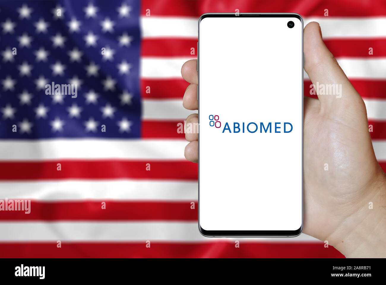 Logo of public company ABIOMED Inc displayed on a smartphone. Flag of ...