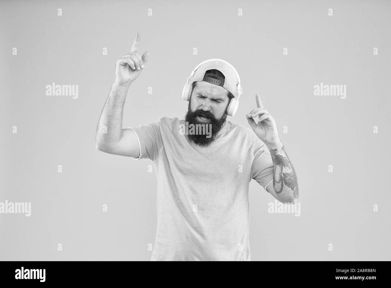 Man in headphones yellow Black and White Stock Photos & Images - Alamy