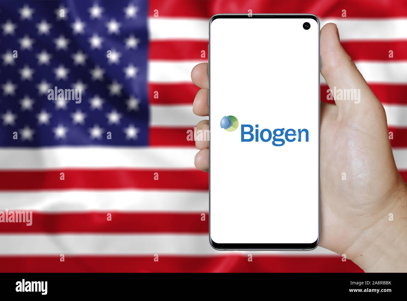 Logo of public company Biogen Inc. displayed on a smartphone. Flag of ...