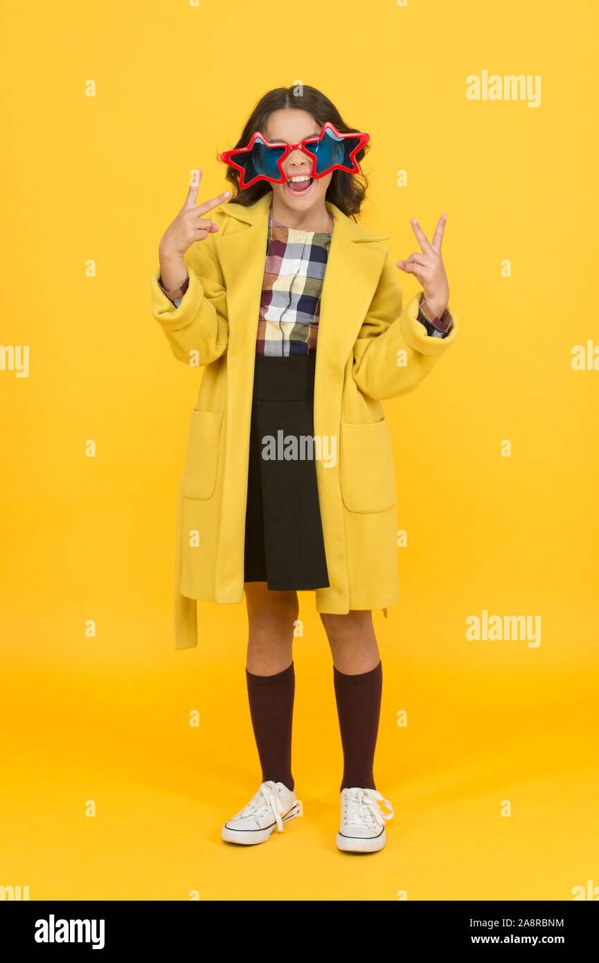 Party girl. Happy child make victory hand gestures. Little kid ...