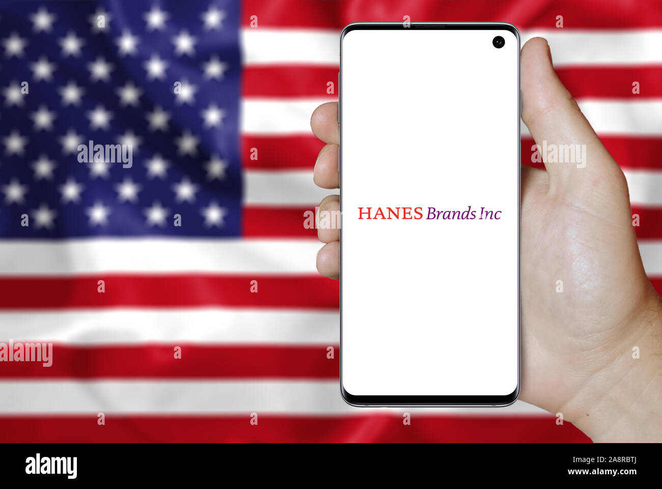 Logo of public company Hanesbrands Inc displayed on a smartphone. Flag ...