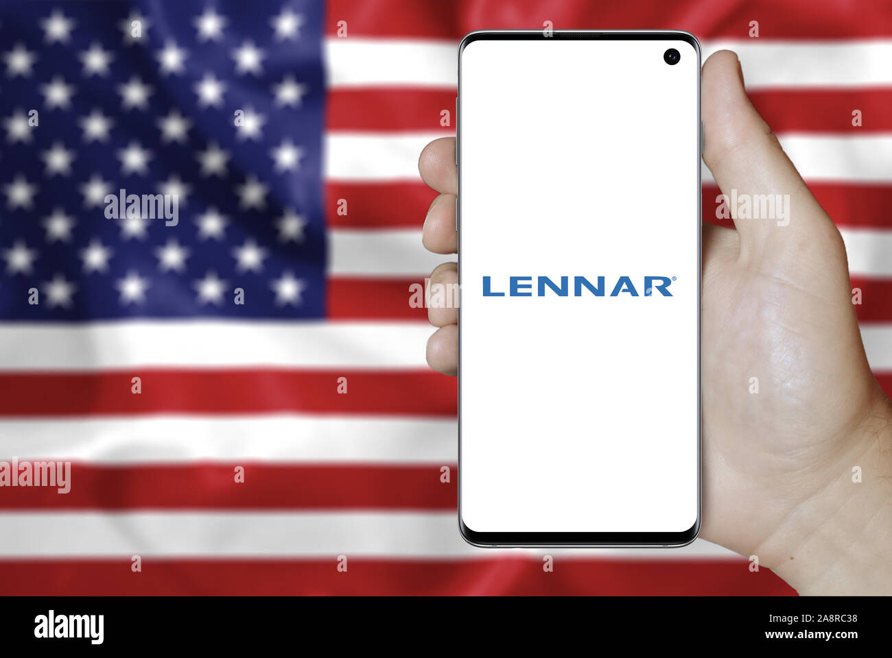 Logo of public company Lennar Corp. displayed on a smartphone. Flag of ...