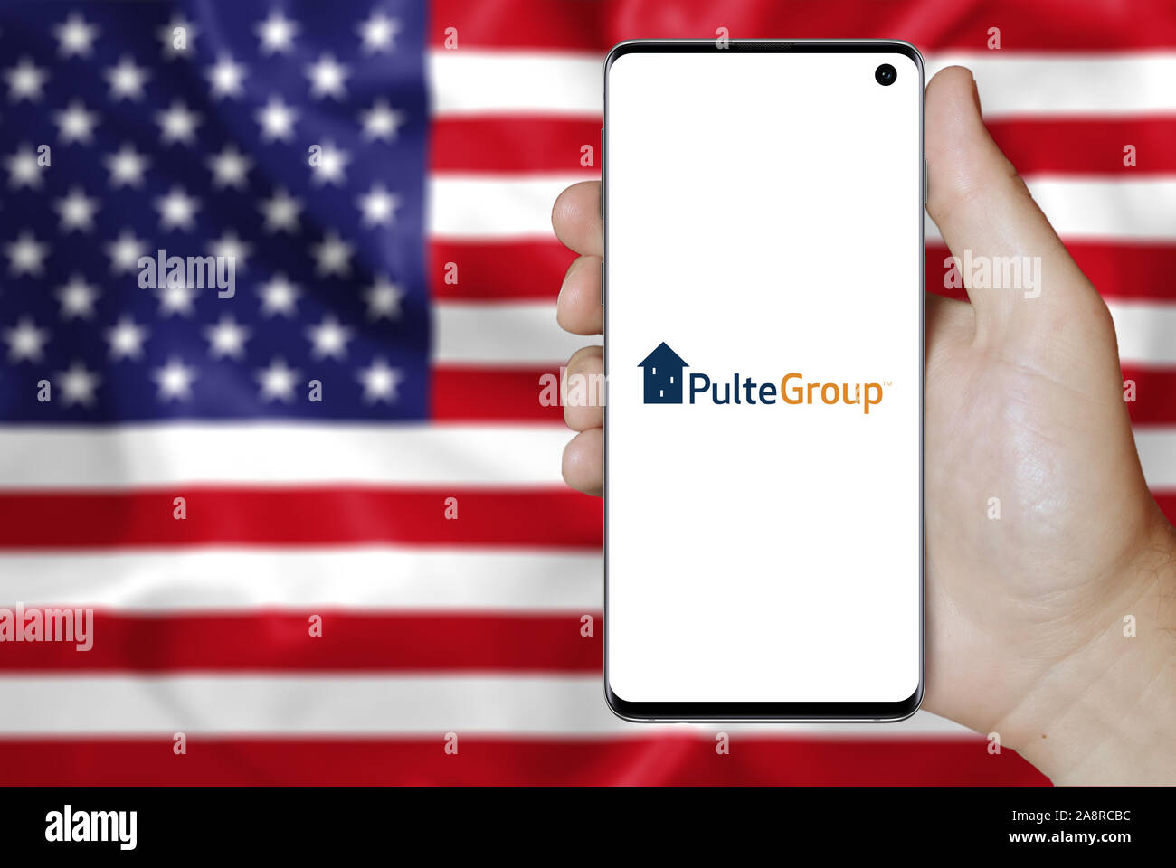 Logo of public company PulteGroup displayed on a smartphone. Flag of ...
