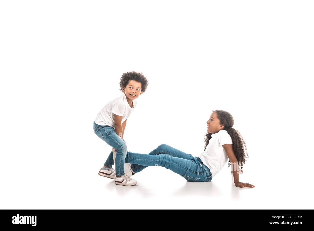 Two children dragging Cut Out Stock Images & Pictures - Alamy