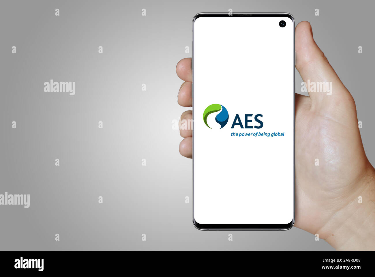 Logo of public company AES Corp displayed on a smartphone. Grey ...