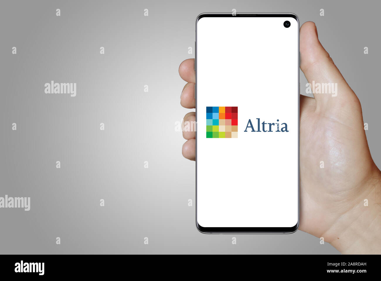 Logo of public company Altria Group Inc displayed on a smartphone. Grey ...