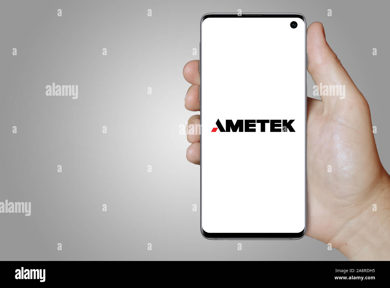 Logo of public company AMETEK Inc displayed on a smartphone. Grey ...