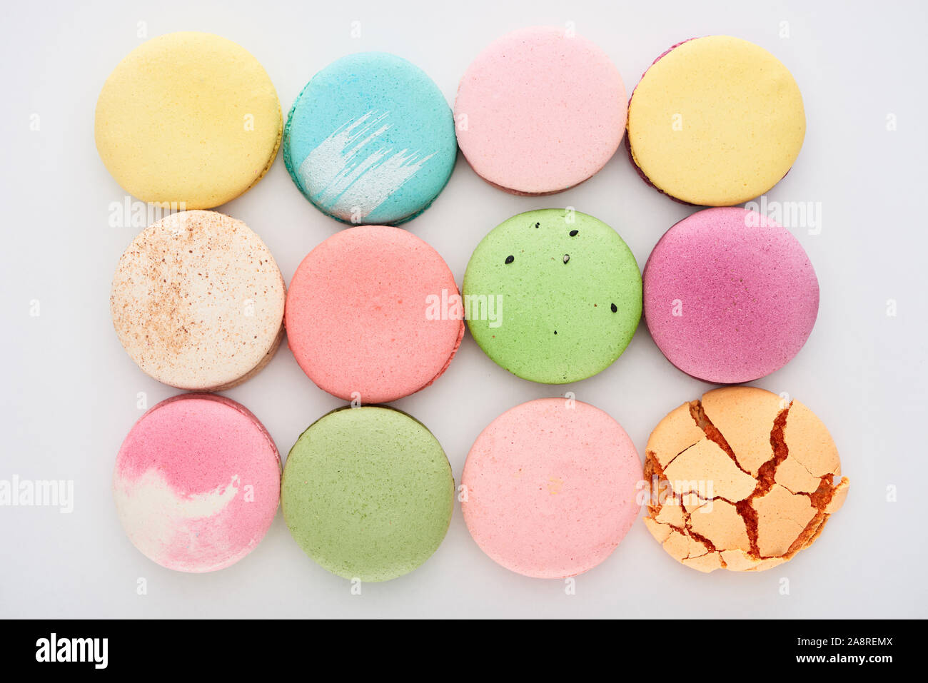 flat lay with delicious colorful French macaroons of different flavors ...