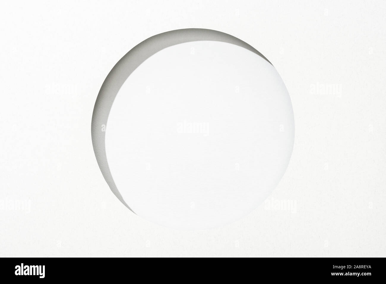 cut out round hole in white paper on white simple background Stock ...