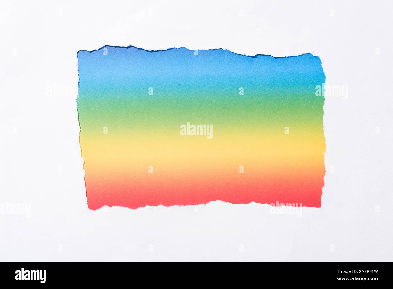 rainbow colorful background in white torn paper hole Stock Photo - Alamy