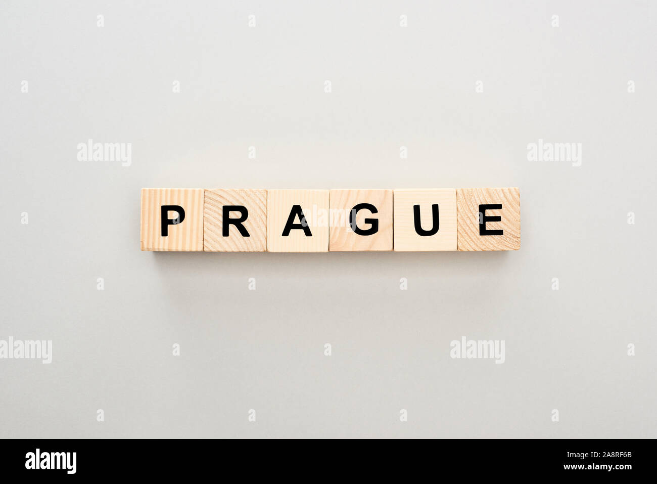 top view of wooden blocks with Prague lettering on white background ...