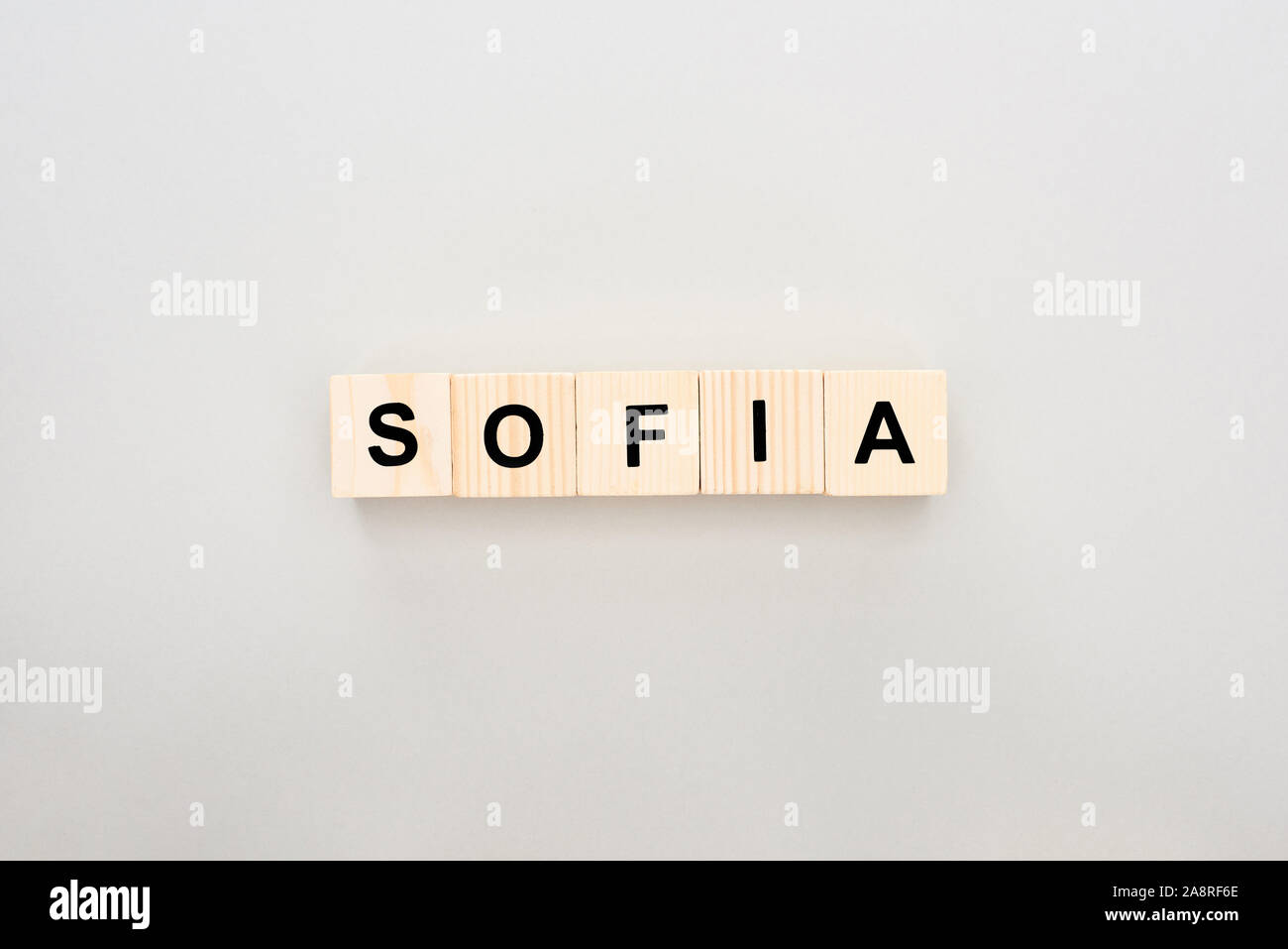 top view of wooden blocks with Sofia lettering on white background ...