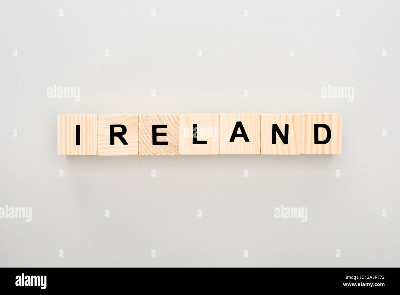 top view of wooden blocks with Ireland lettering on white background ...
