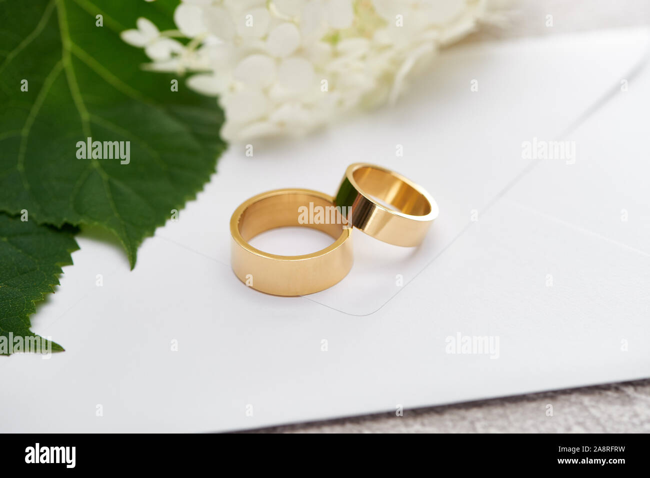 Wedding rings on envelope letter hi-res stock photography and images ...