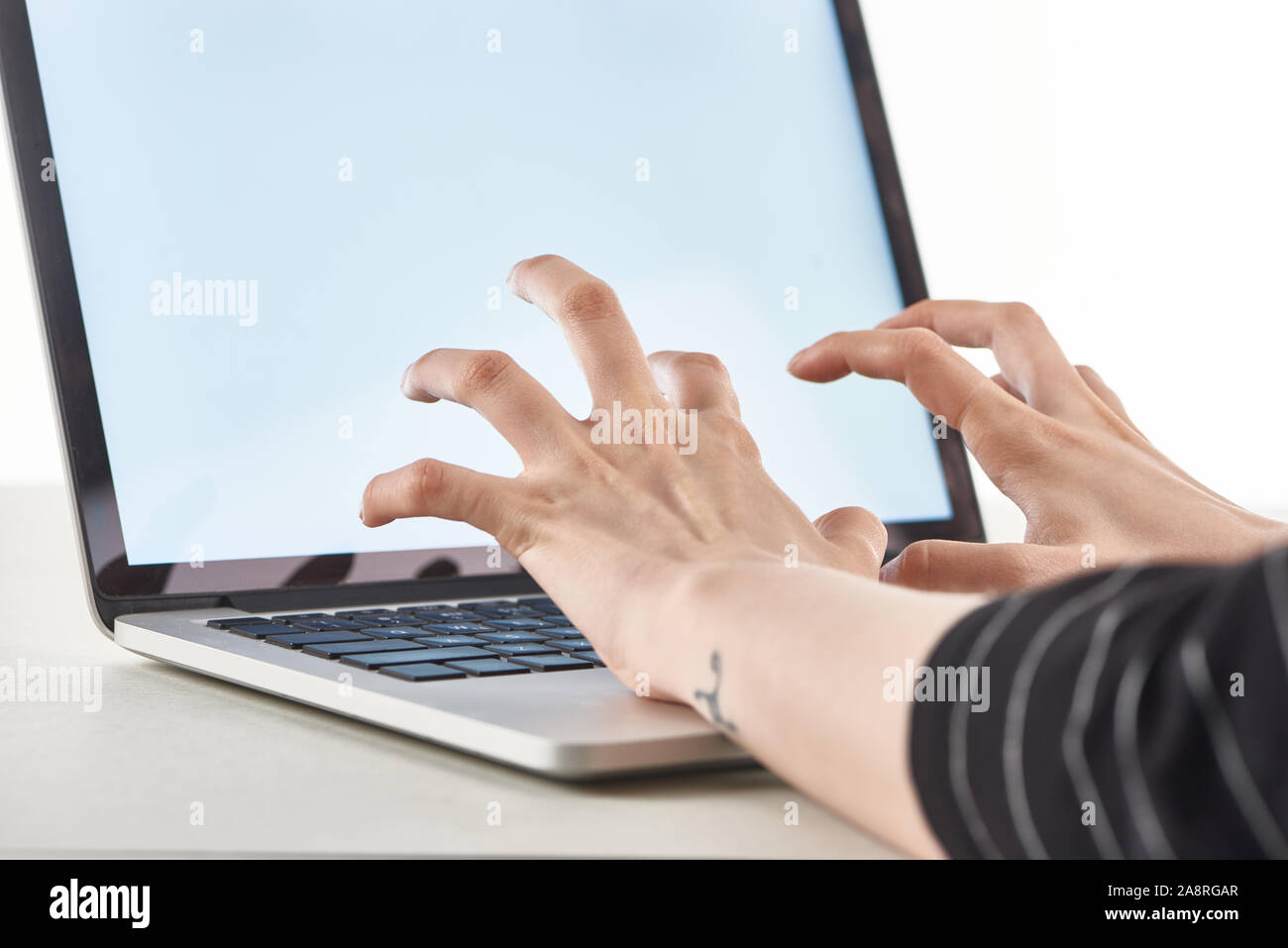 Woman angry computer typing hi-res stock photography and images - Alamy