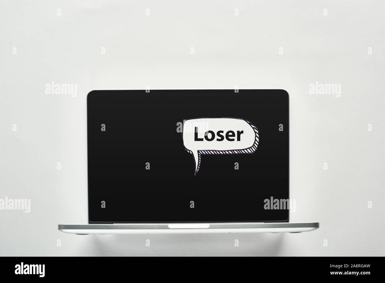 laptop with loser word in speech bubble on white background ...