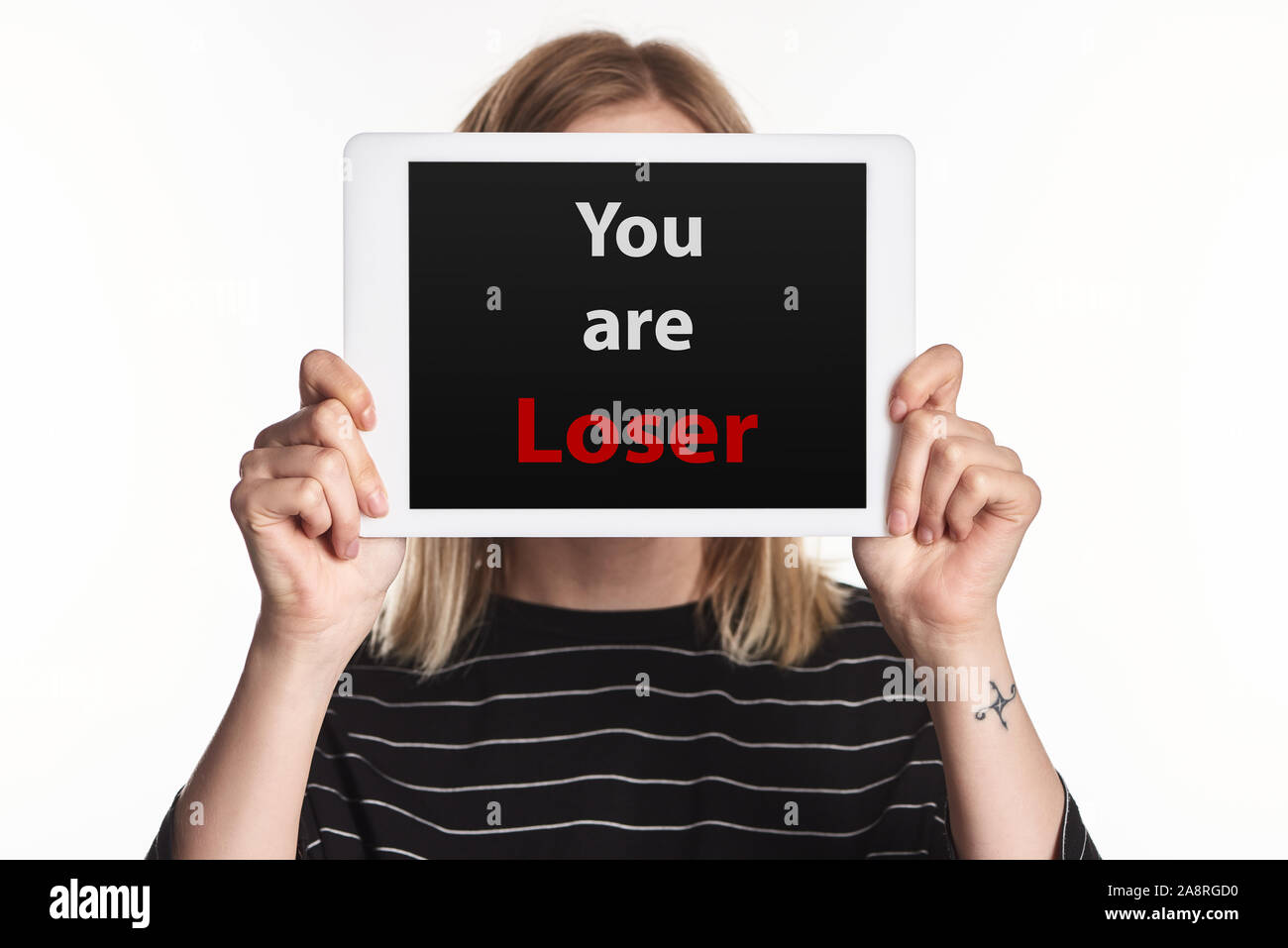 victim of cyberbullying showing digital tablet with you are loser ...
