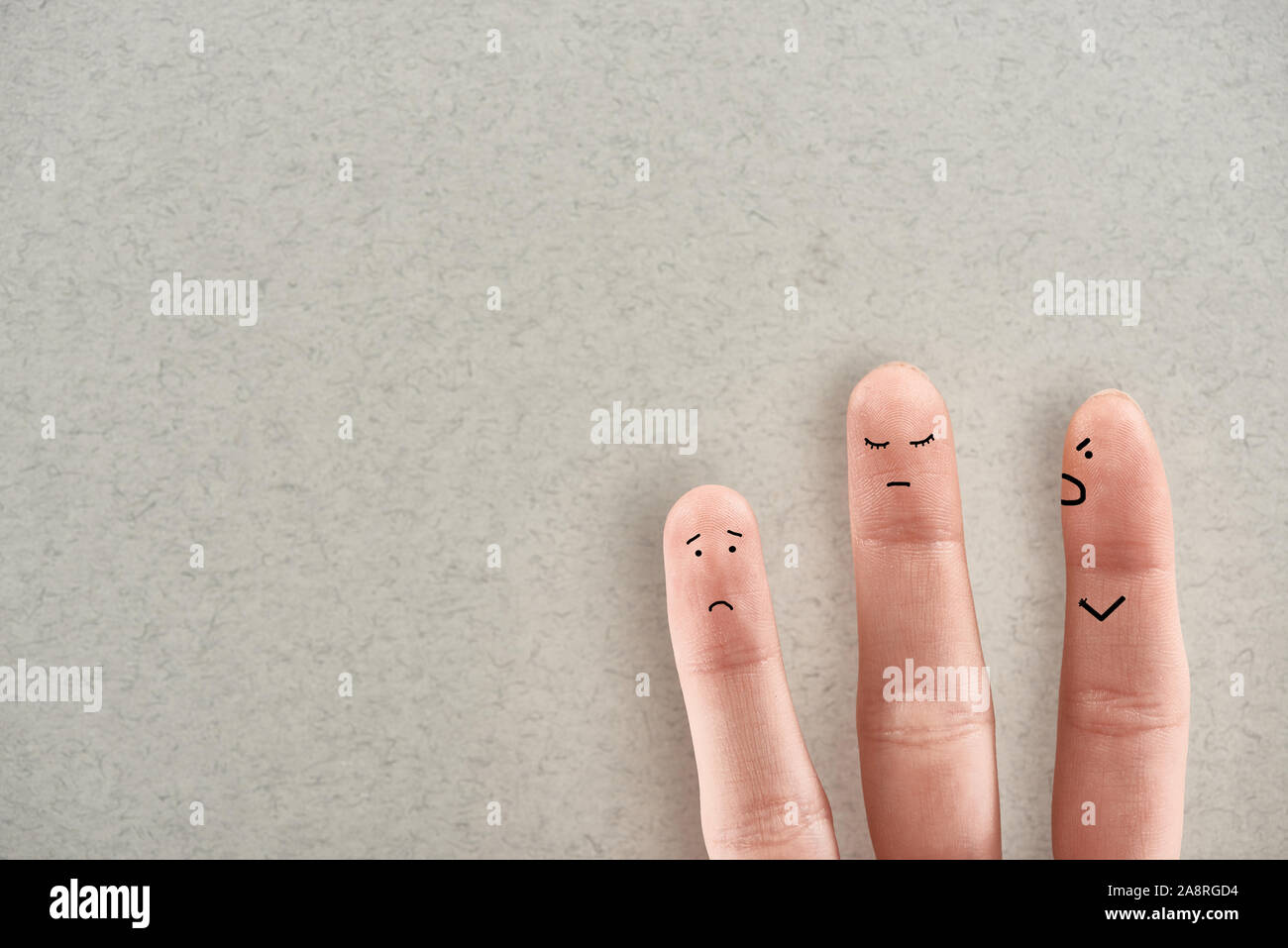 partial view of man showing three fingers symbolizing aggressive abuser ...