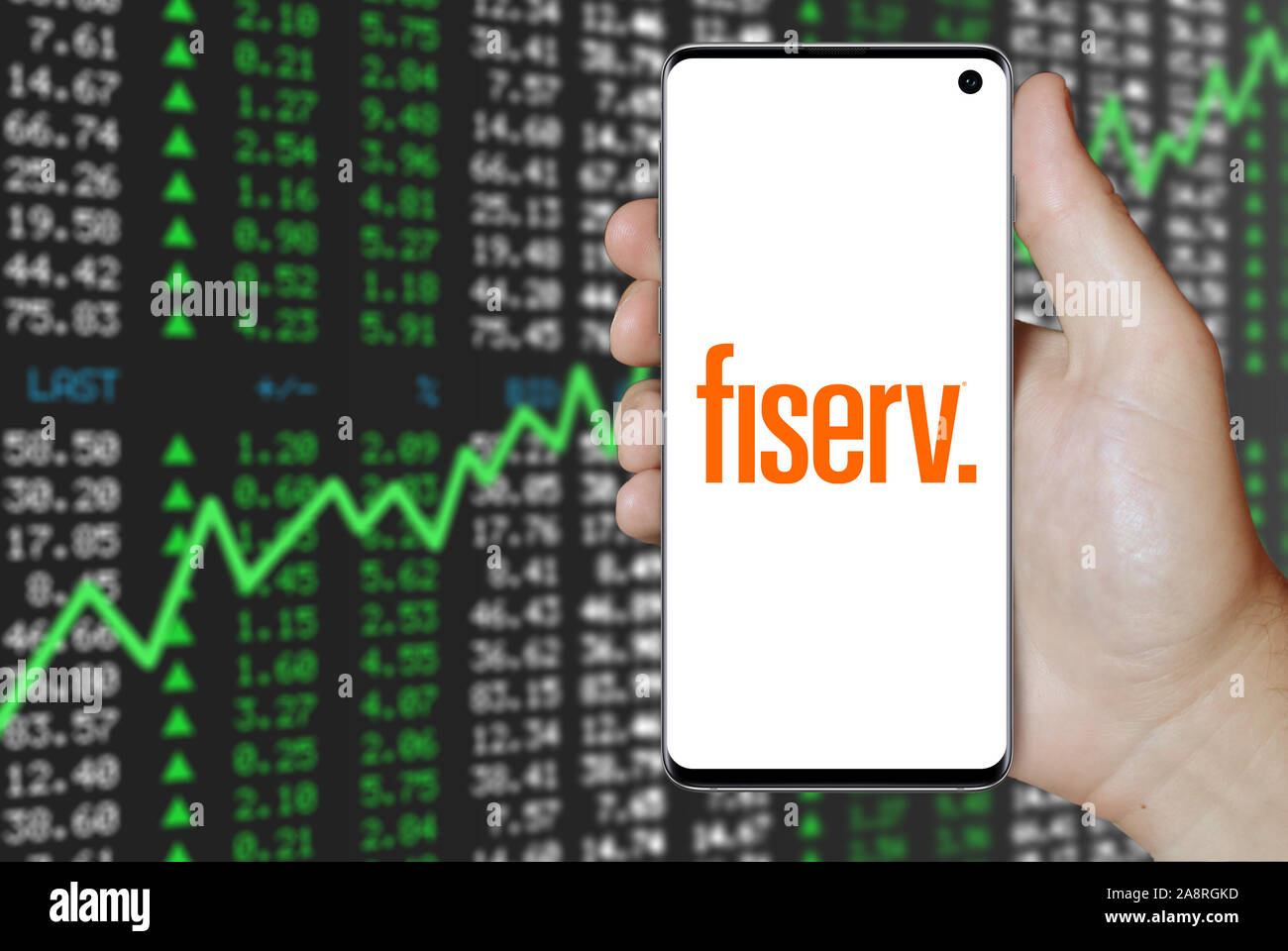 Logo of public company Fiserv Inc displayed on a smartphone. Positive ...