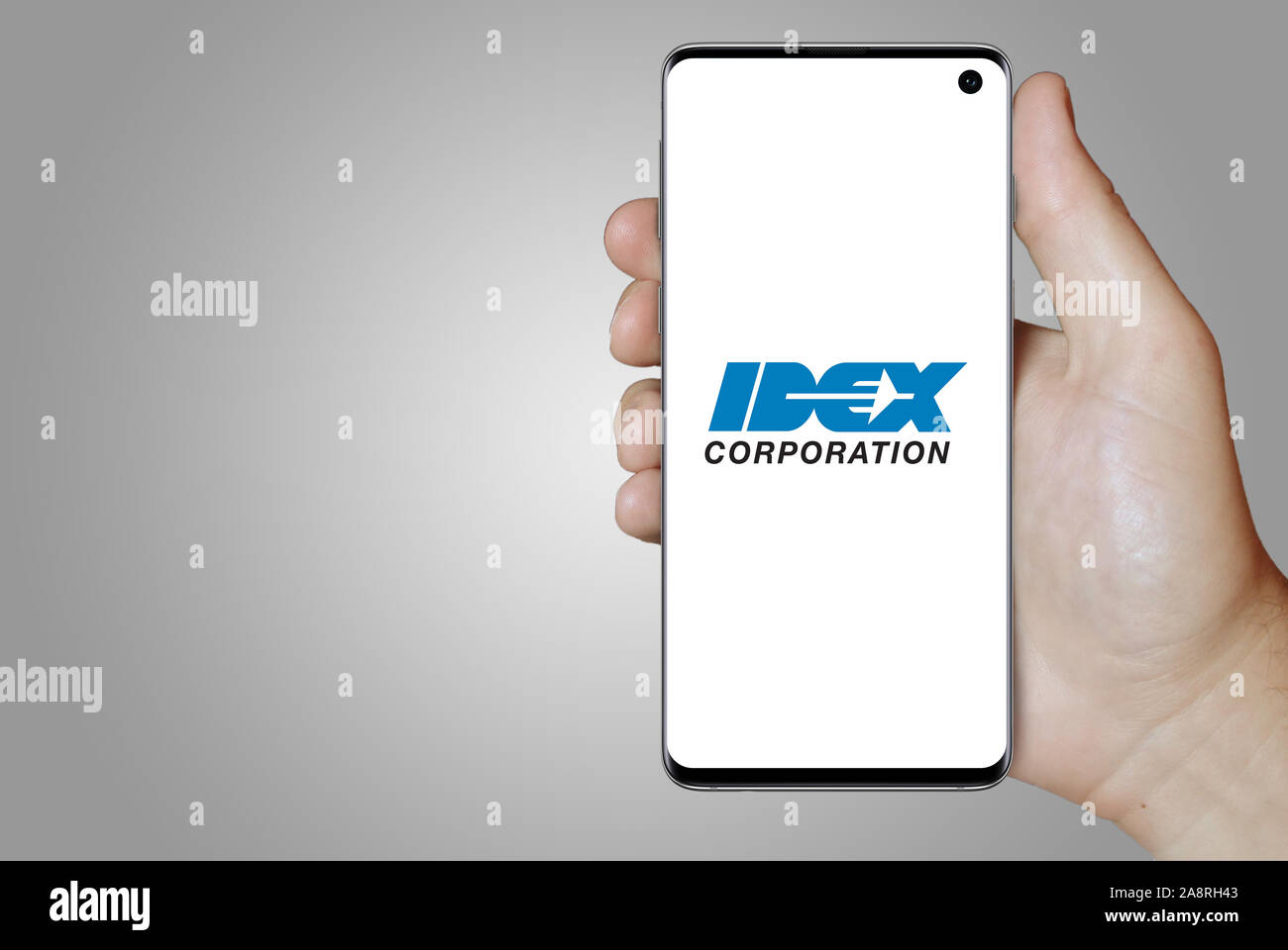 Logo of public company IDEX Corporation displayed on a smartphone. Grey ...