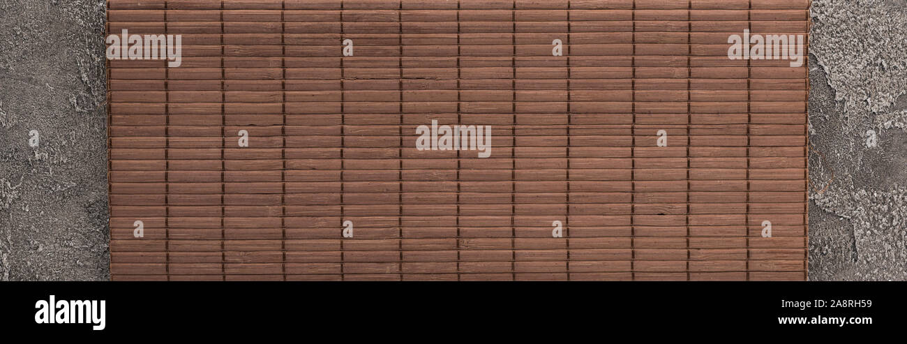 top view of bamboo mat on dark stone table Stock Photo - Alamy