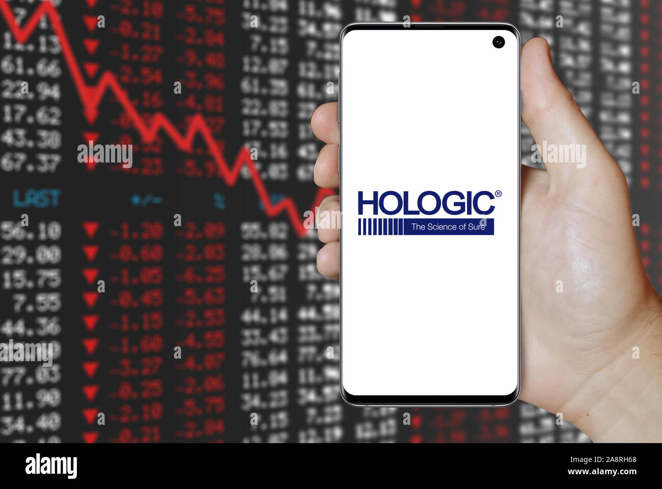Logo of public company Hologic displayed on a smartphone. Negative ...