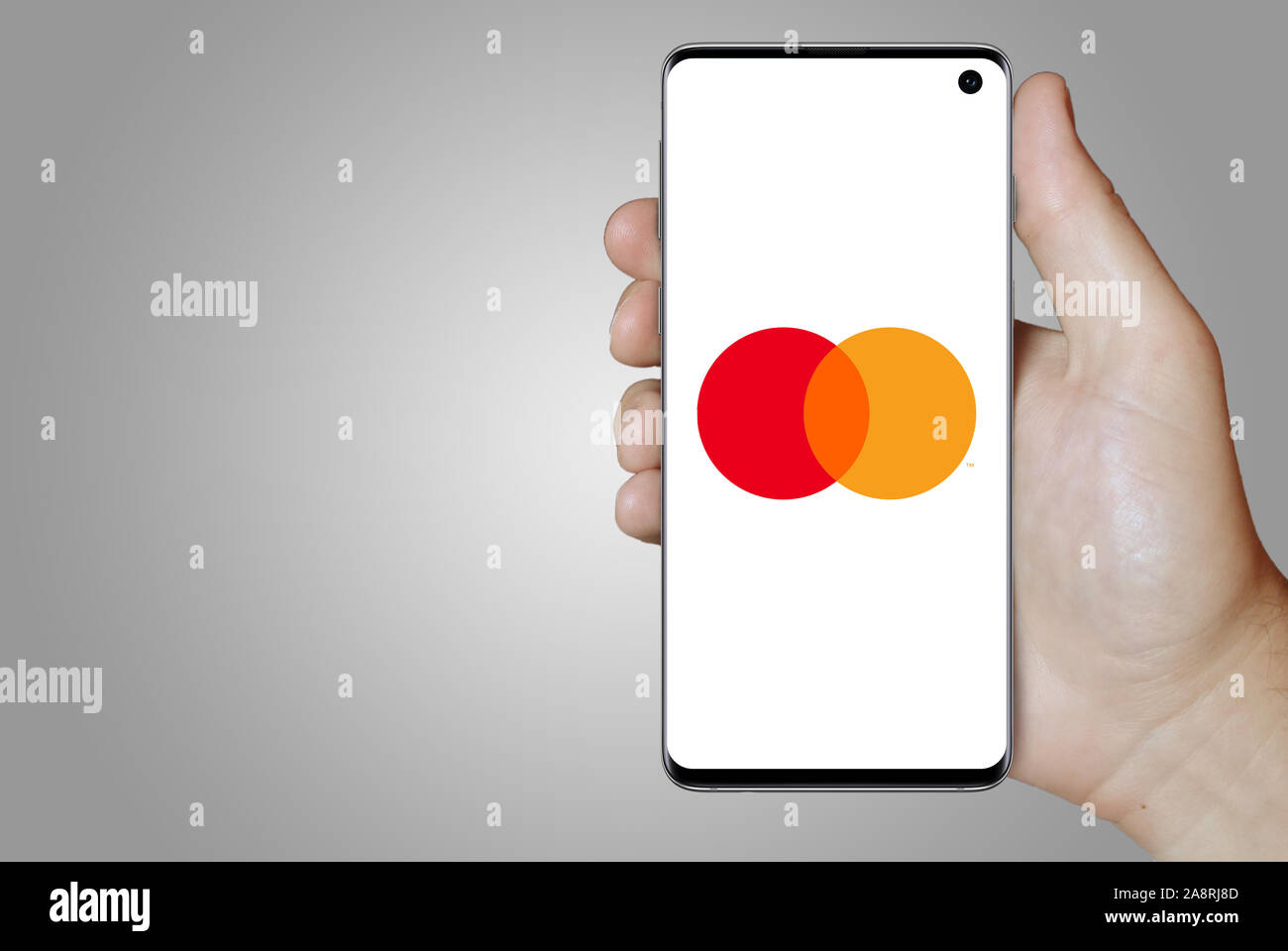 Logo of public company Mastercard Inc. displayed on a smartphone. Grey ...