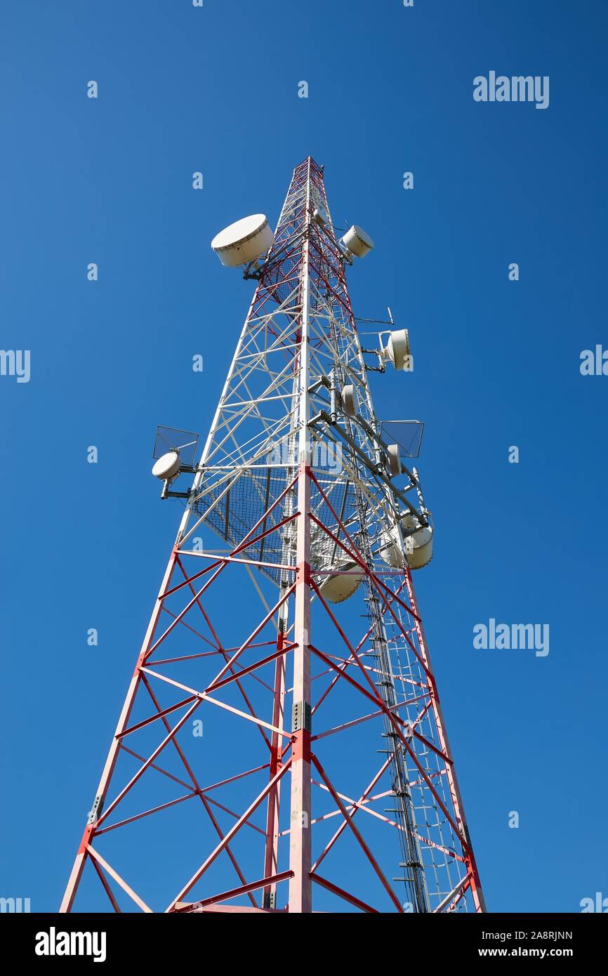 Transmitter towers, blue sky Stock Photo - Alamy