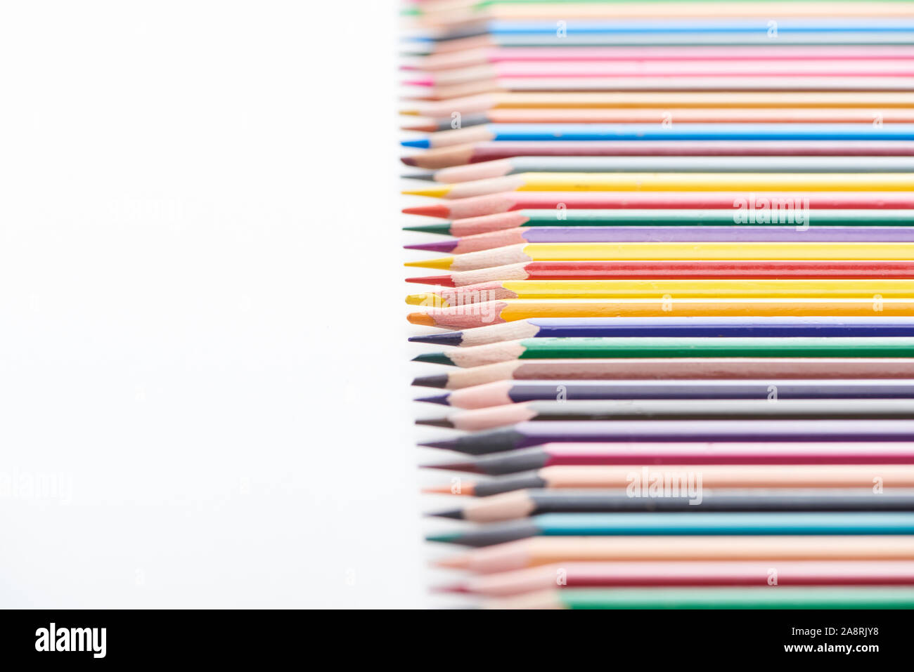 Straight row of sharpened color pencils isolated on white Stock Photo - Alamy
